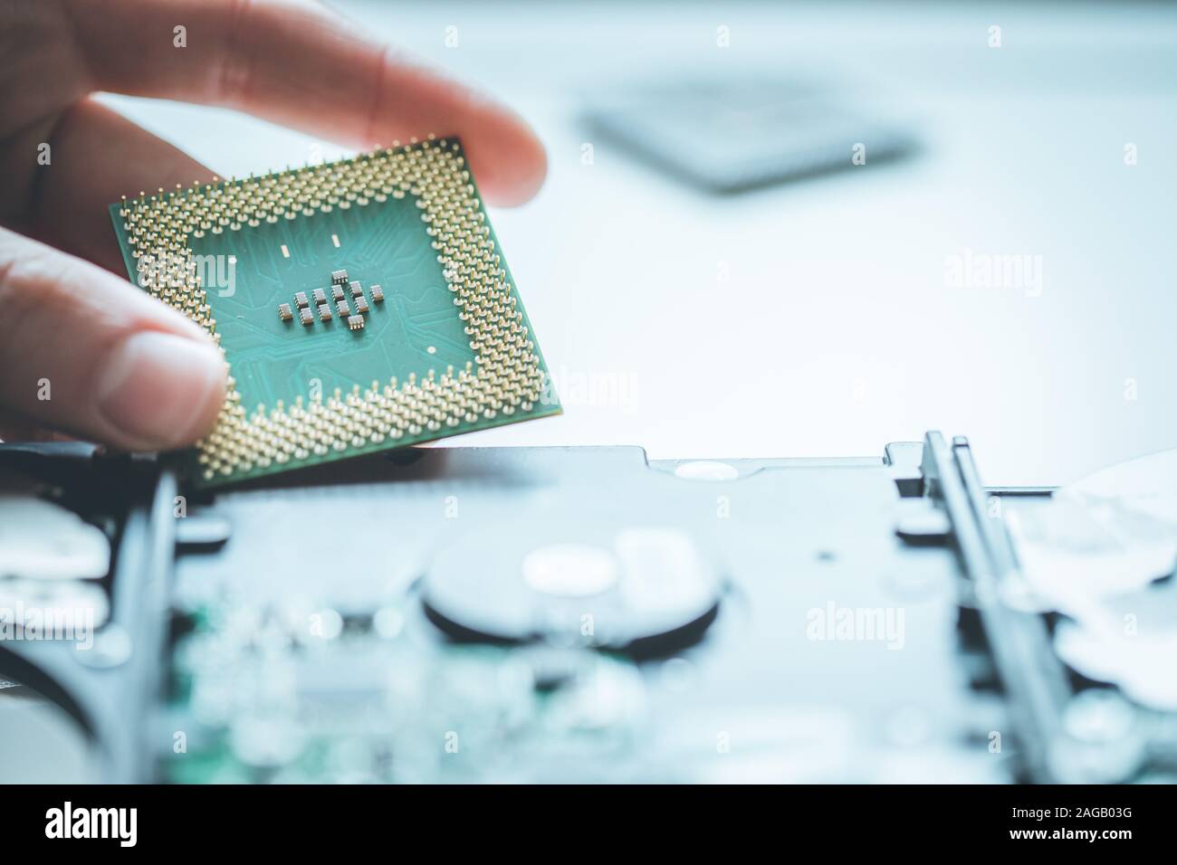 Male hand is holding a cpu, close up; Computer technology Stock Photo ...
