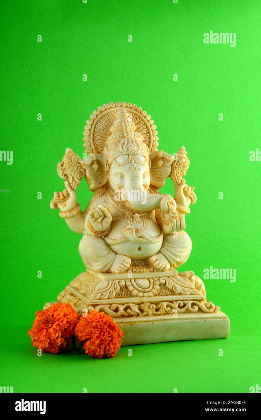 Hindu God Ganesha. Ganesha Idol on green background Stock Photo - Alamy