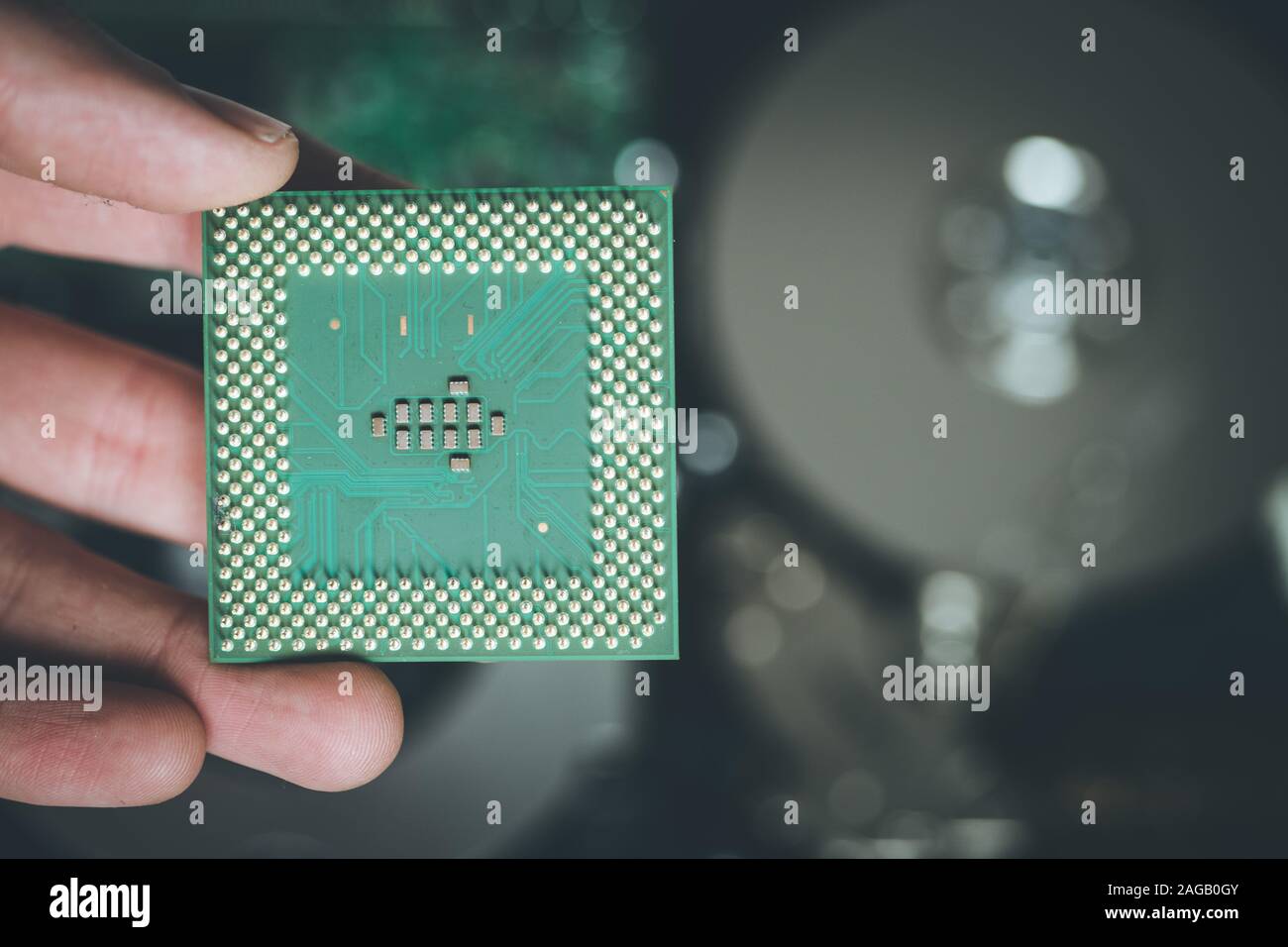 Male hand is holding a cpu, close up; Computer technology Stock Photo ...