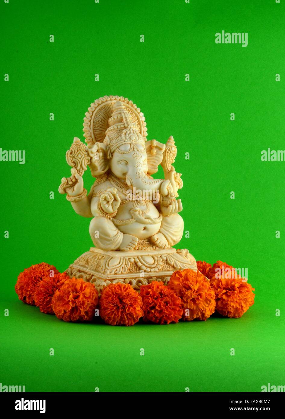 Hindu God Ganesha. Ganesha Idol on green background Stock Photo - Alamy