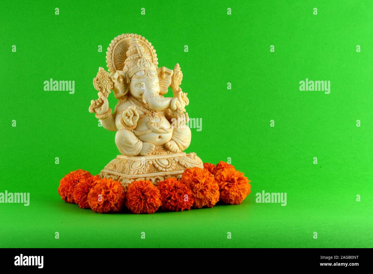 Hindu God Ganesha. Ganesha Idol on green background Stock Photo - Alamy