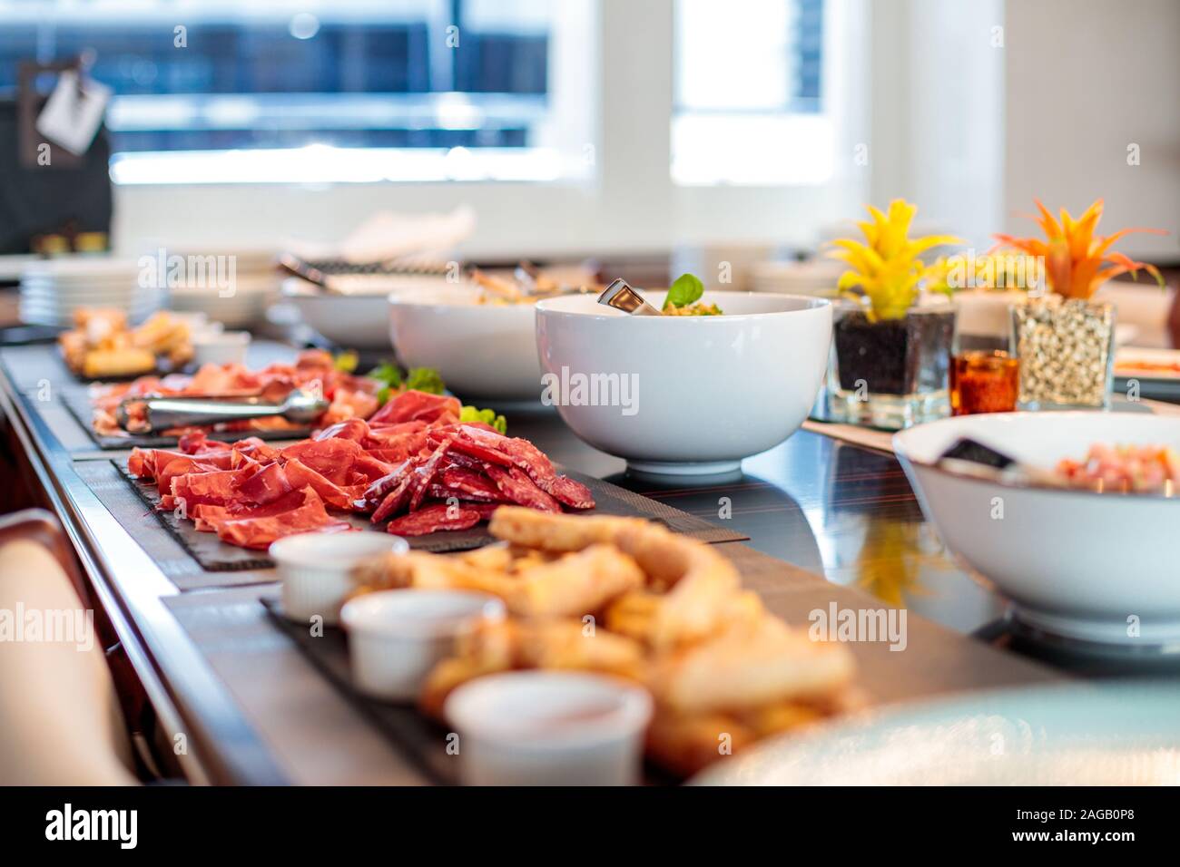 Brunch table with assorted dishes with meat and vegetables Stock Photo ...