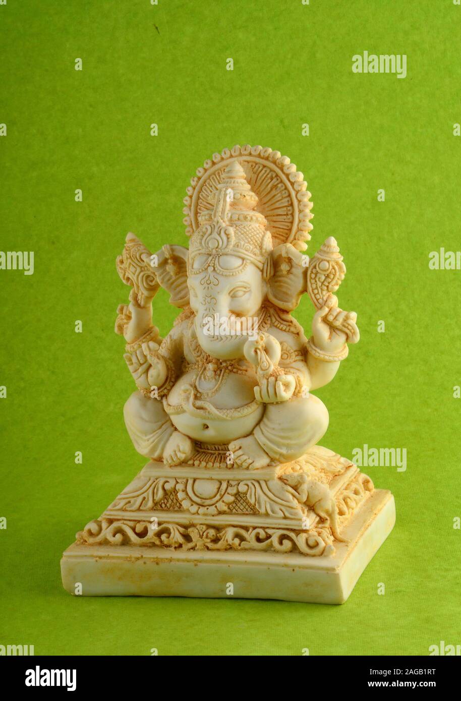 Hindu God Ganesha. Ganesha Idol on green background Stock Photo - Alamy