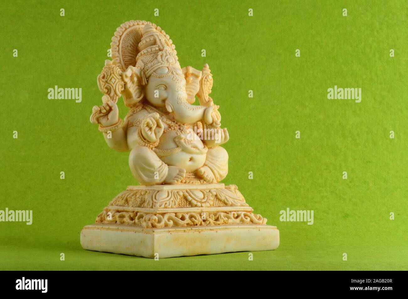 Hindu God Ganesha. Ganesha Idol on green background Stock Photo - Alamy