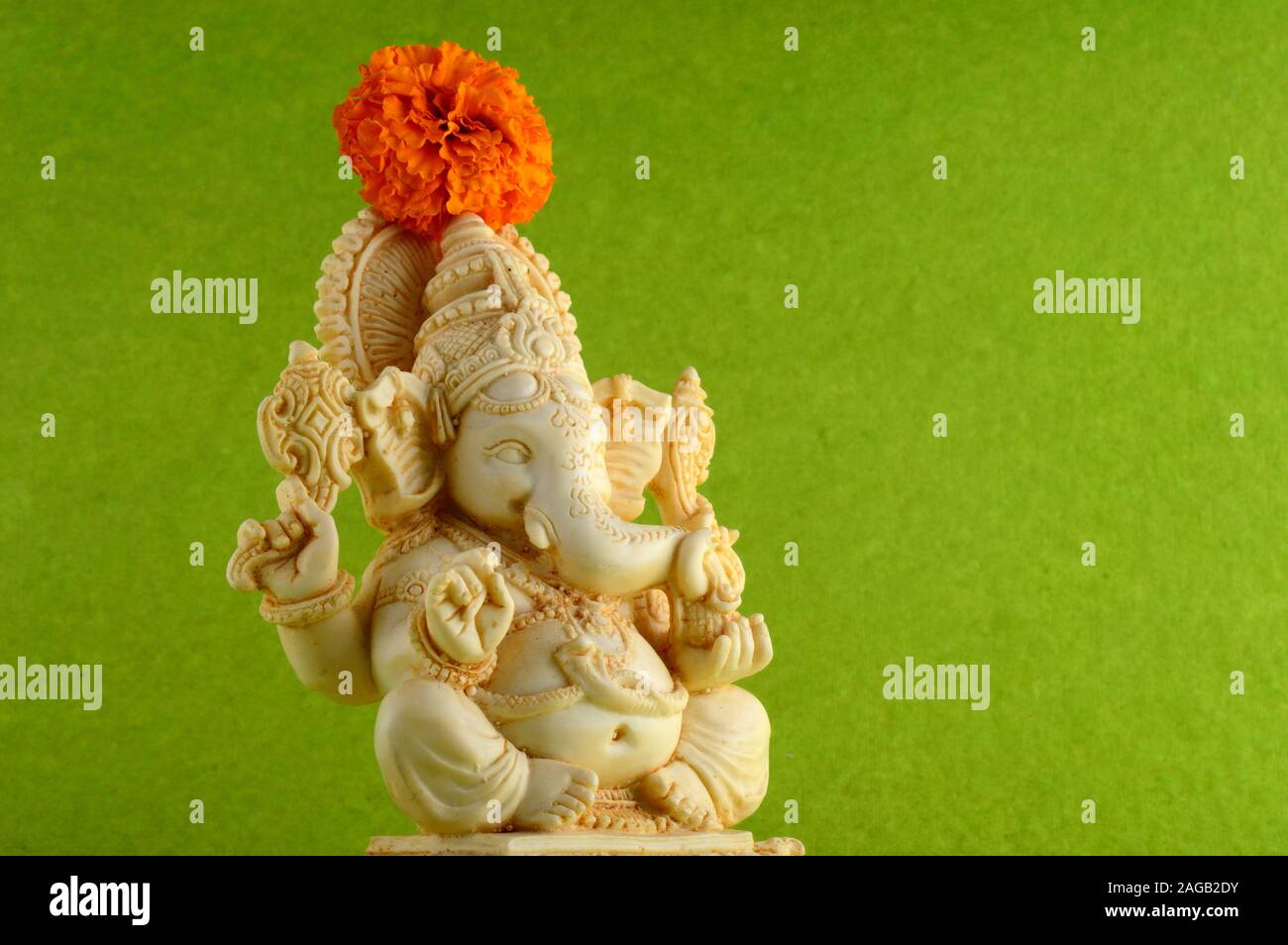 Hindu God Ganesha. Ganesha Idol on green background Stock Photo - Alamy