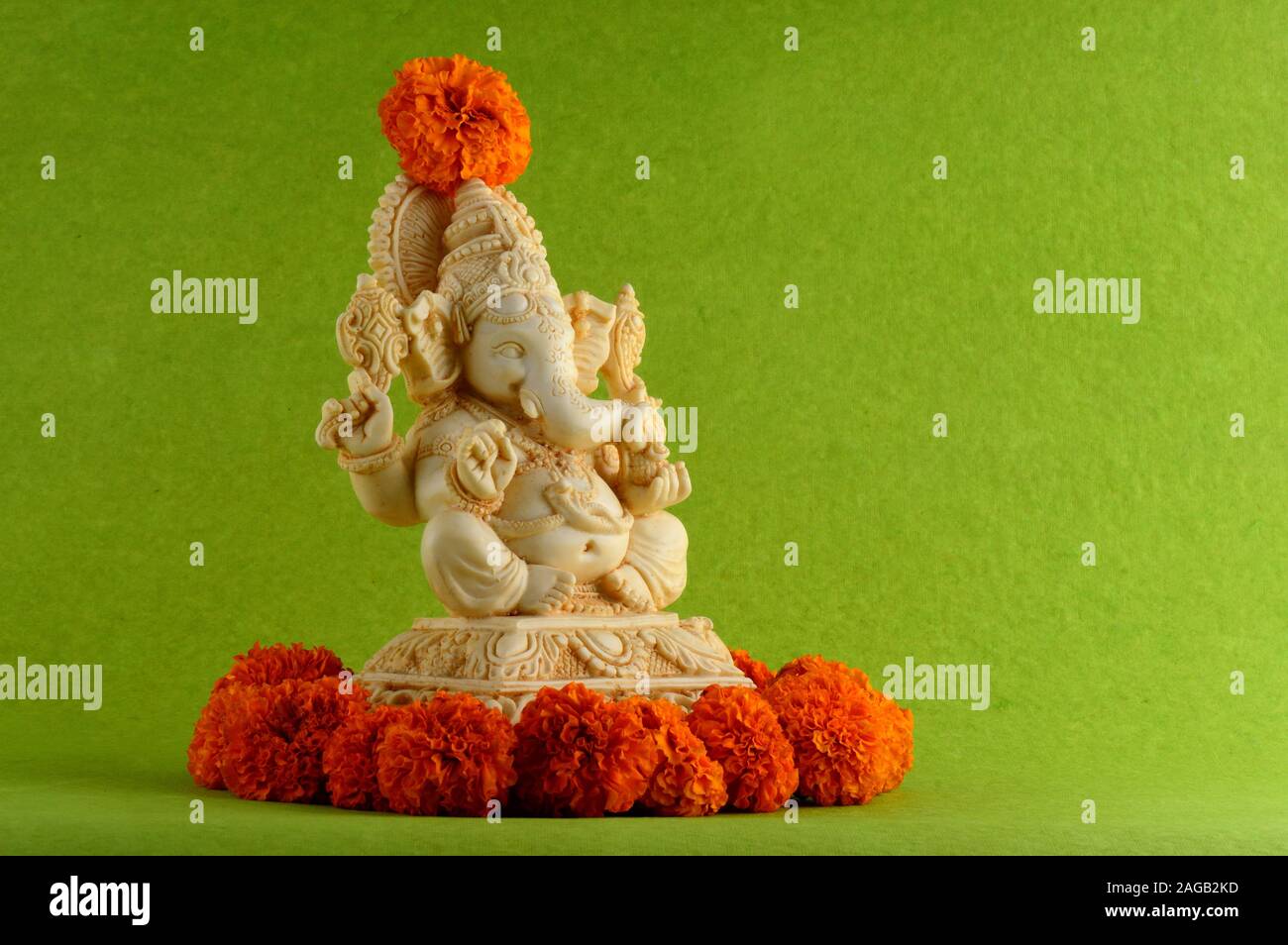Hindu God Ganesha. Ganesha Idol on green background Stock Photo - Alamy