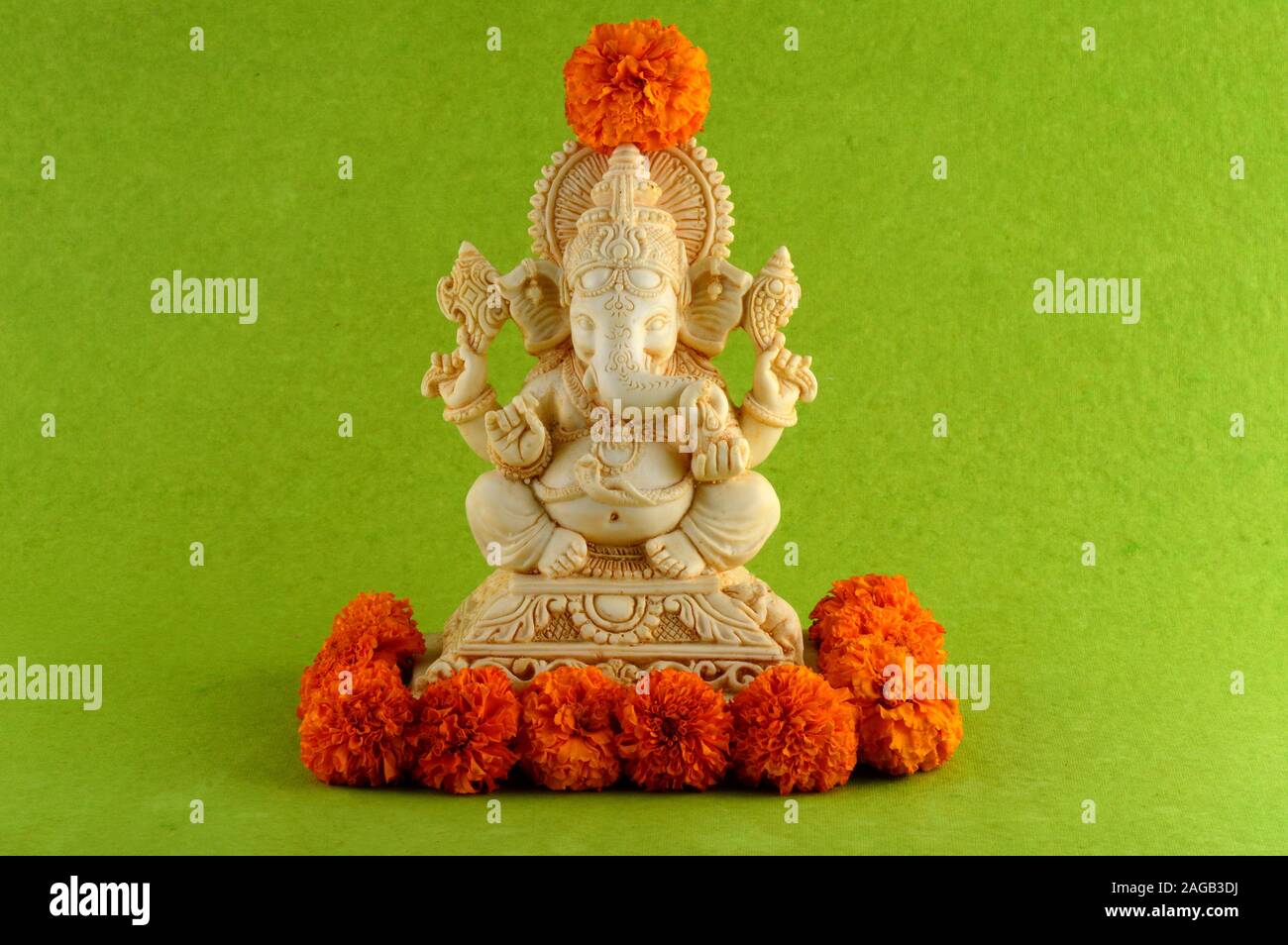 Hindu God Ganesha. Ganesha Idol on green background Stock Photo - Alamy