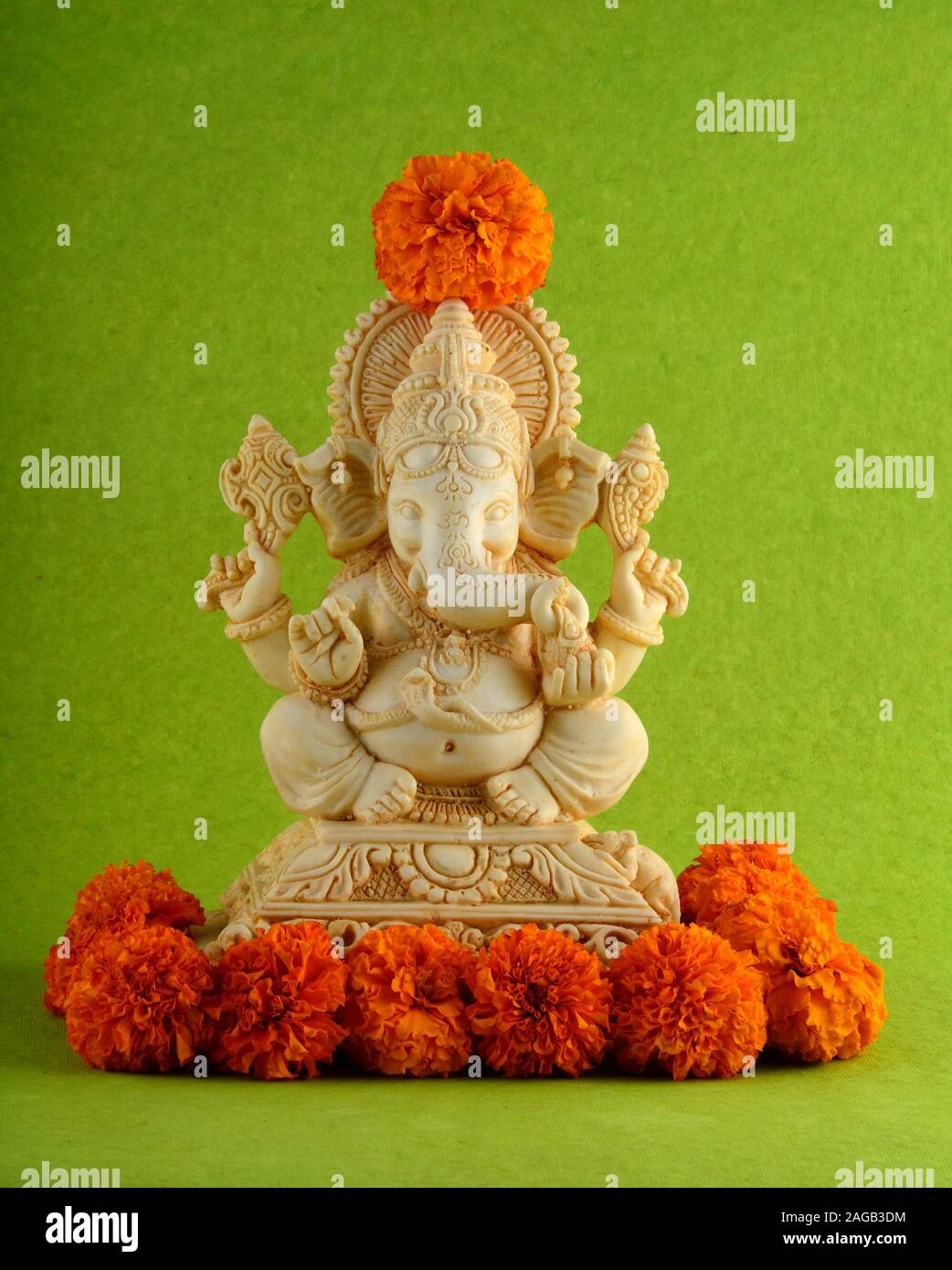 Hindu God Ganesha. Ganesha Idol on green background Stock Photo - Alamy