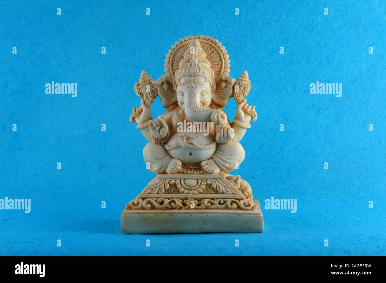 Hindu God Ganesha. Ganesha Idol on blue background Stock Photo - Alamy