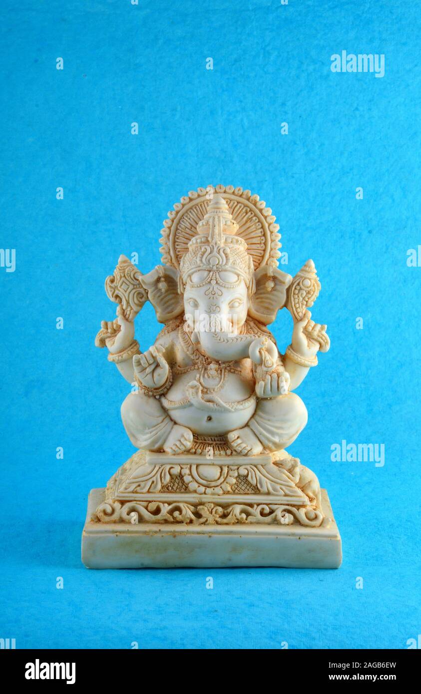 Hindu God Ganesha. Ganesha Idol on blue background Stock Photo - Alamy