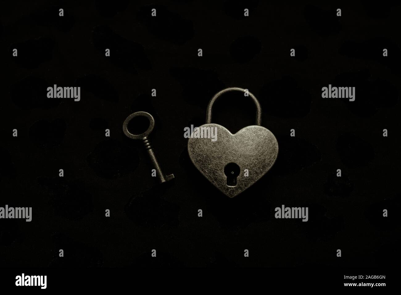 Heart shaped lock and key on an abstract background Stock Photo - Alamy
