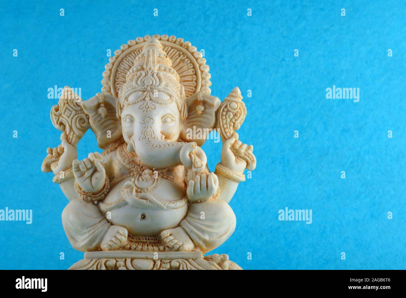 Hindu God Ganesha. Ganesha Idol on blue background Stock Photo - Alamy