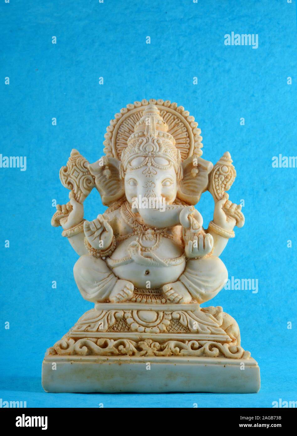 Hindu God Ganesha. Ganesha Idol on blue background Stock Photo - Alamy