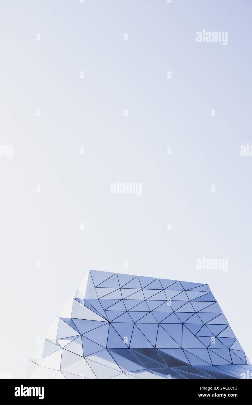 Vertical shot of a geometrical structure on a bright background Stock ...