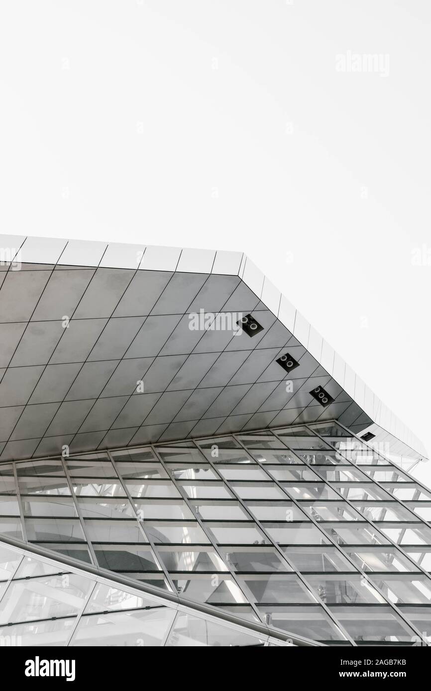 Vertical grey scale shot of a geometrical structure captured from a low ...