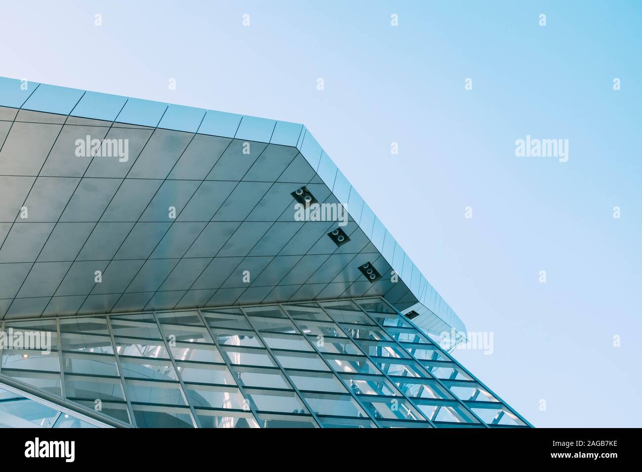 Low angle shot of a metal and glass geometrical structure under the ...