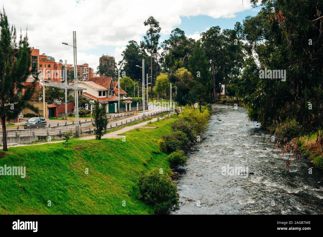 Cuenca, Ecuador - February, 2019 View of the river Tomebamba and public ...