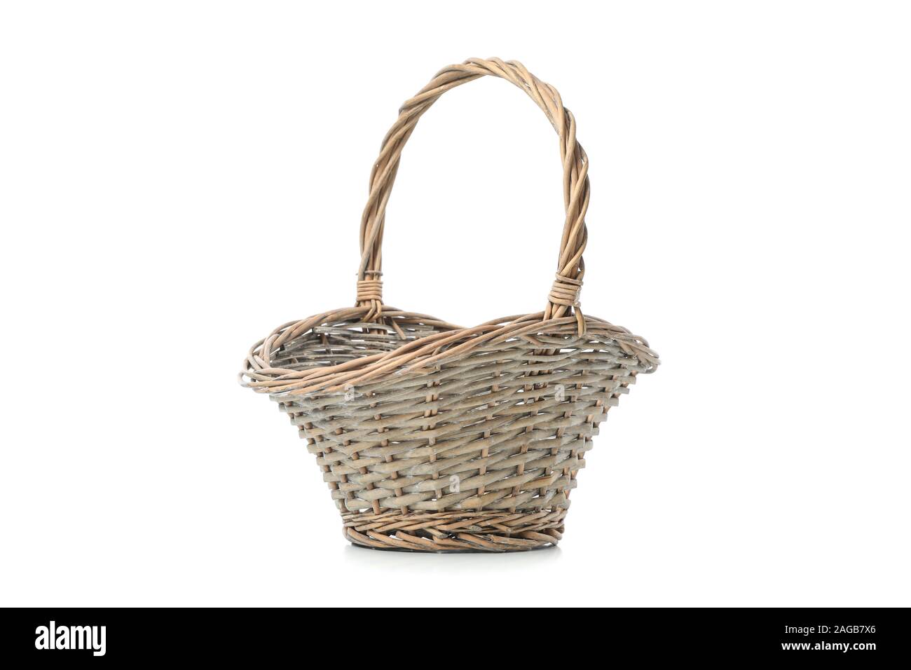 Wicker basket with handle isolated on white background Stock Photo - Alamy