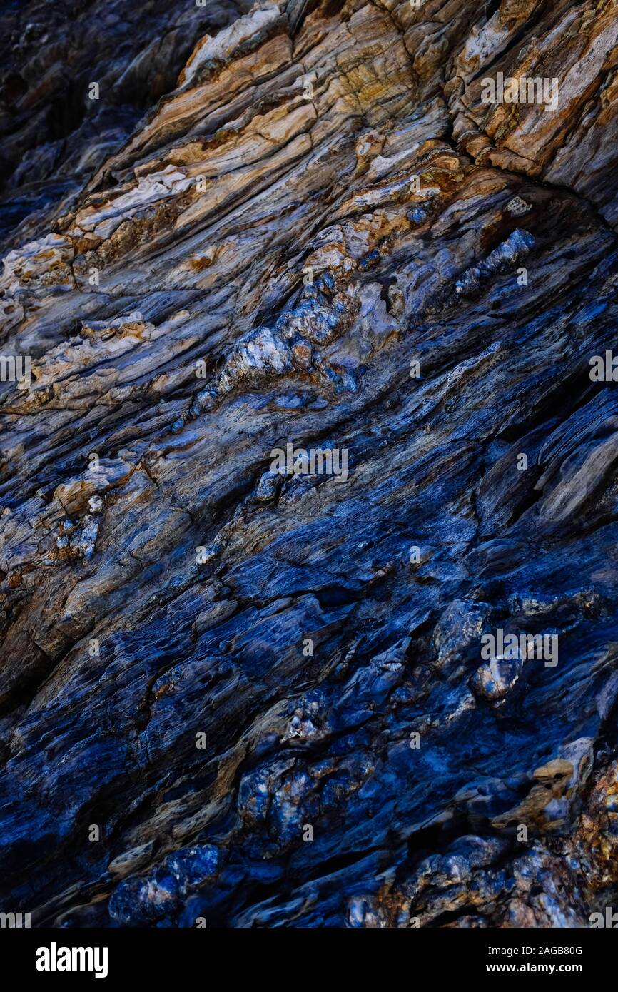 Vertical aerial shot of the patterns of the rocky cliffs Stock Photo ...