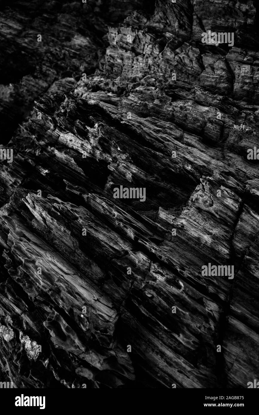 Vertical grey scale shot of the patterns on the rocky cliffs Stock ...