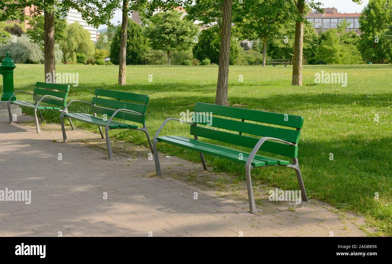 Green benches in park of Pamplona, Navarre, Spain Stock Photo - Alamy