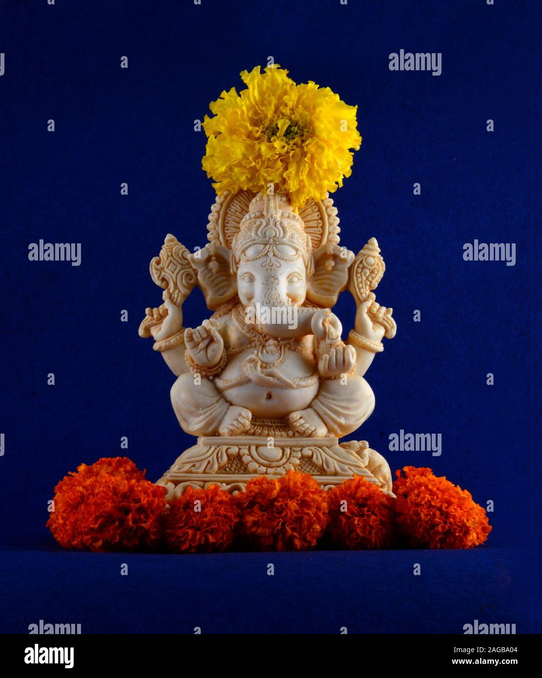 Hindu God Ganesha. Ganesha Idol on blue background Stock Photo - Alamy