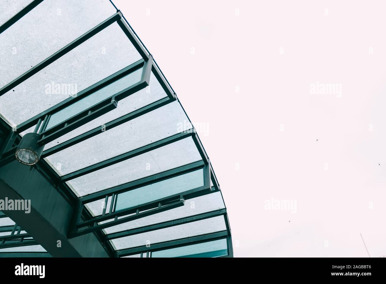 Low angle shot of a roof of a high-rise business building touching the ...