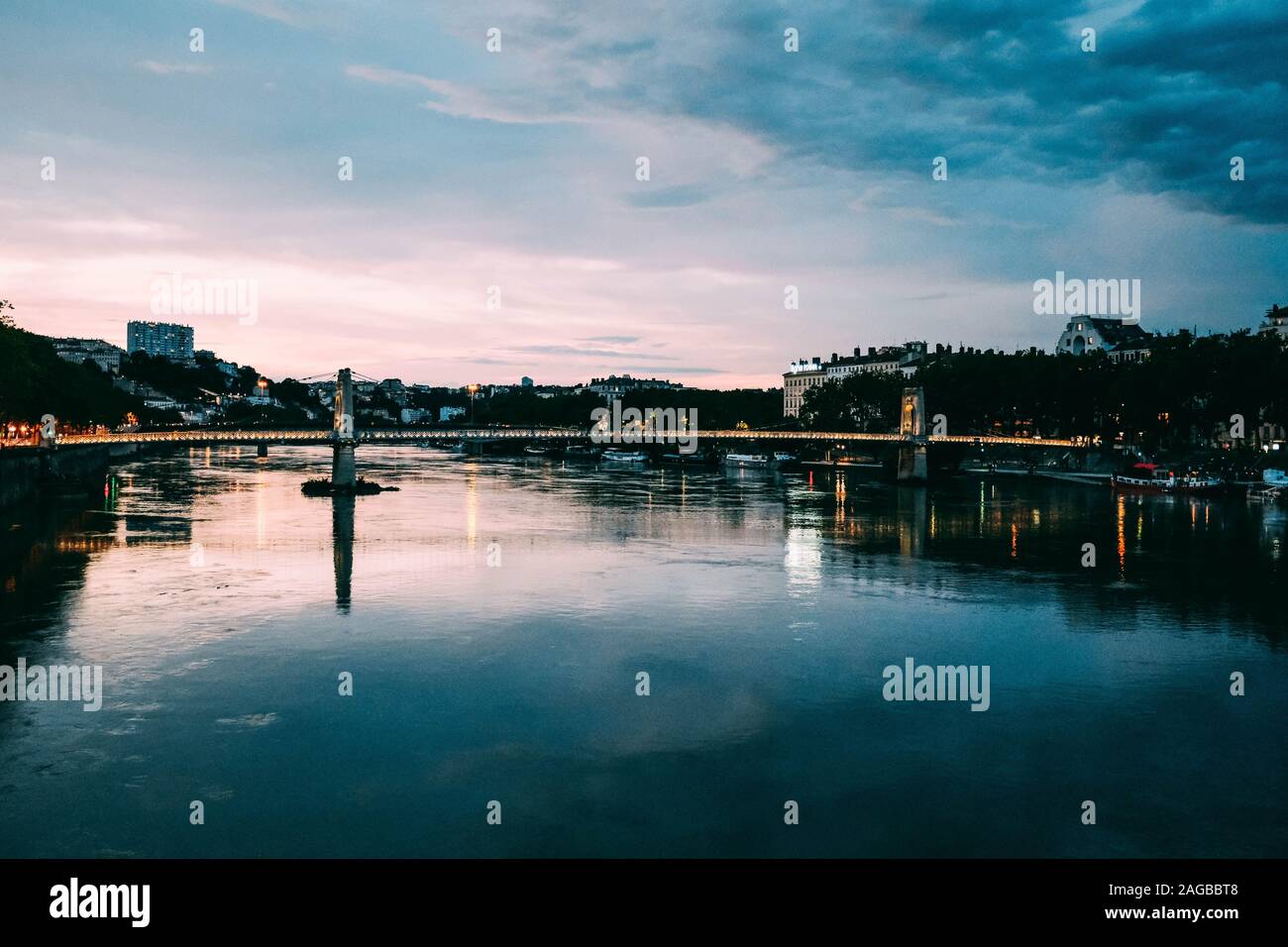 Beautiful view of a bridge going over a river surrounded by buildings ...