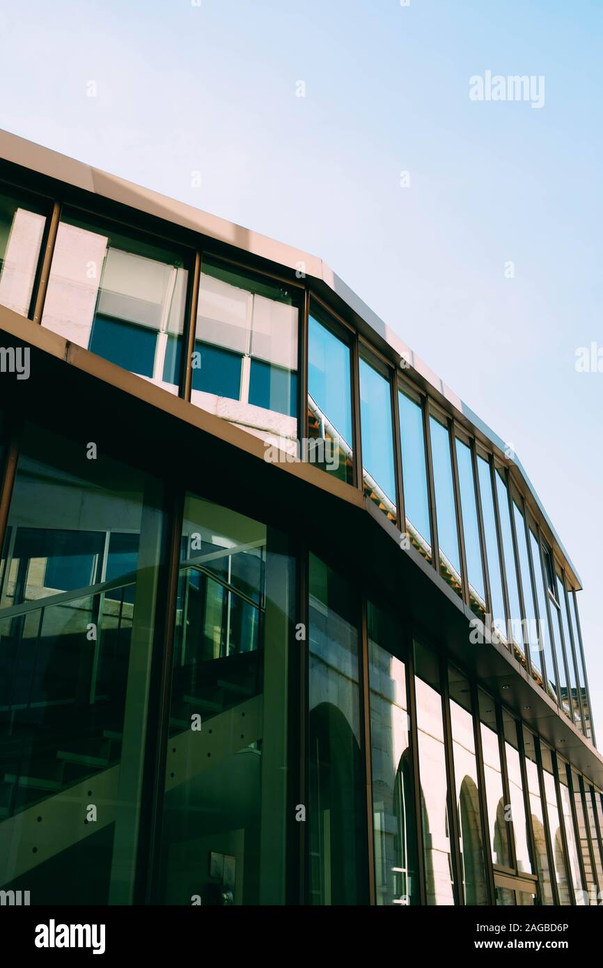 Low angle vertical shot of a modern building with glass windows Stock ...