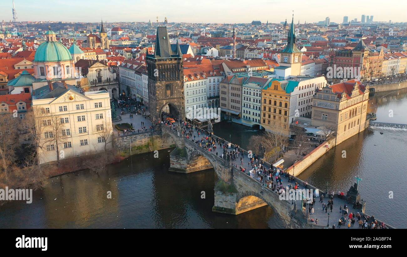 Aerial view of Charles Bridge at sunset light in desember in Prague ...