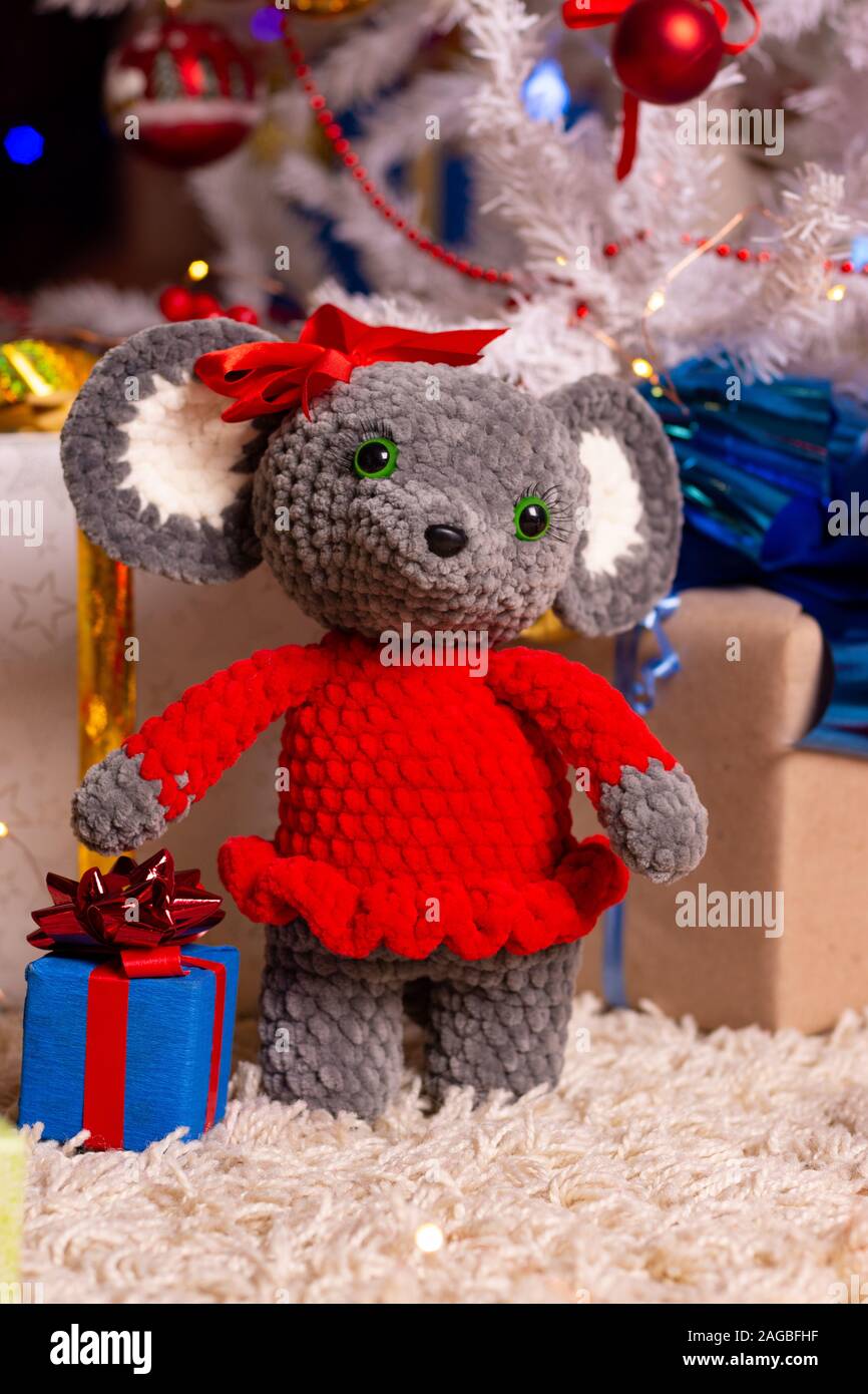 Plush toy mouse girl on New Year's background Stock Photo - Alamy