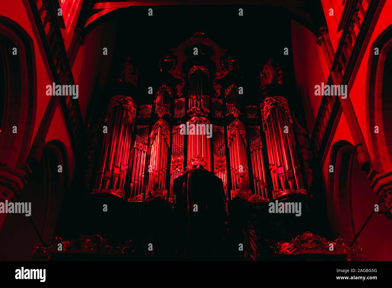Low angle shot of the wall of a church under the red light Stock Photo ...