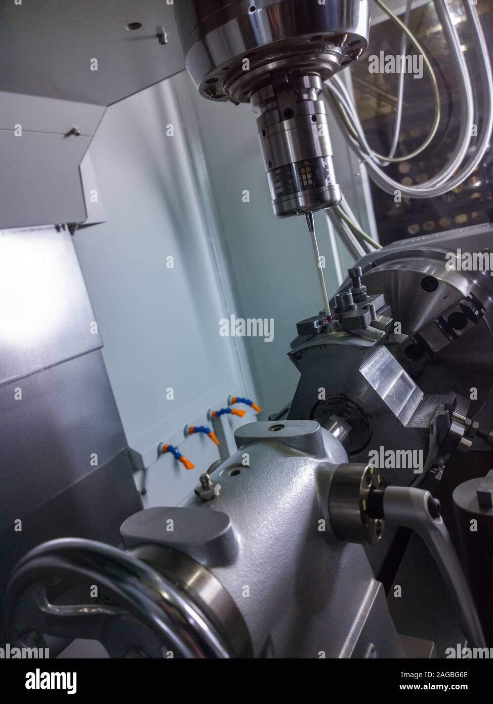 unadorned photo of automated contact probe measuring while producing ...