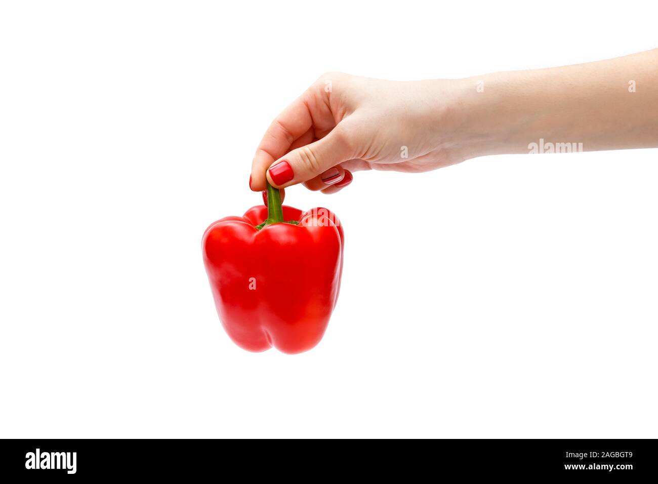 Person holding a red pepper in the hand isolated in front of white ...