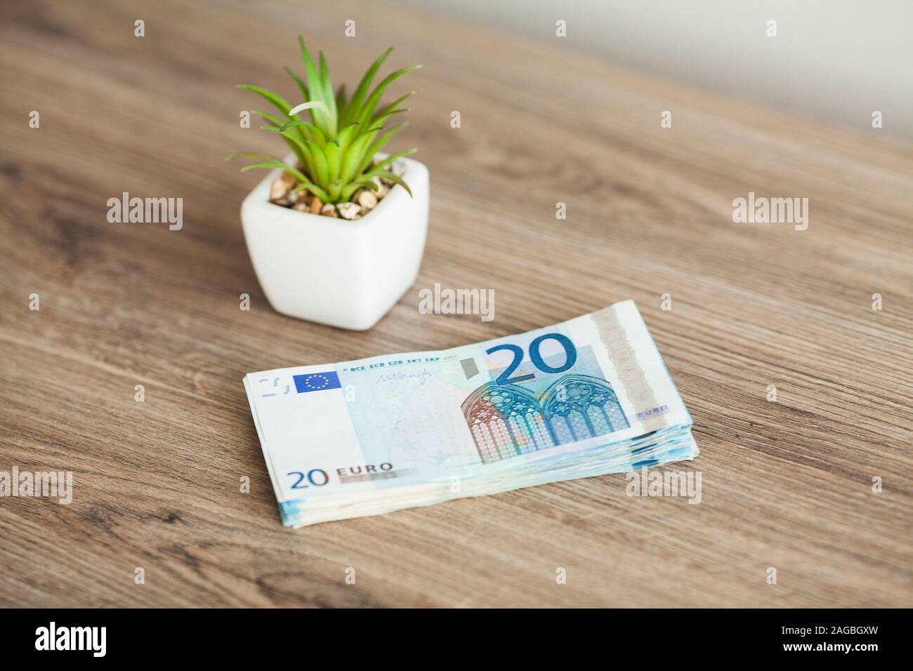 Banknotes with a nominal value of twenty Euro lying like a fan on the ...