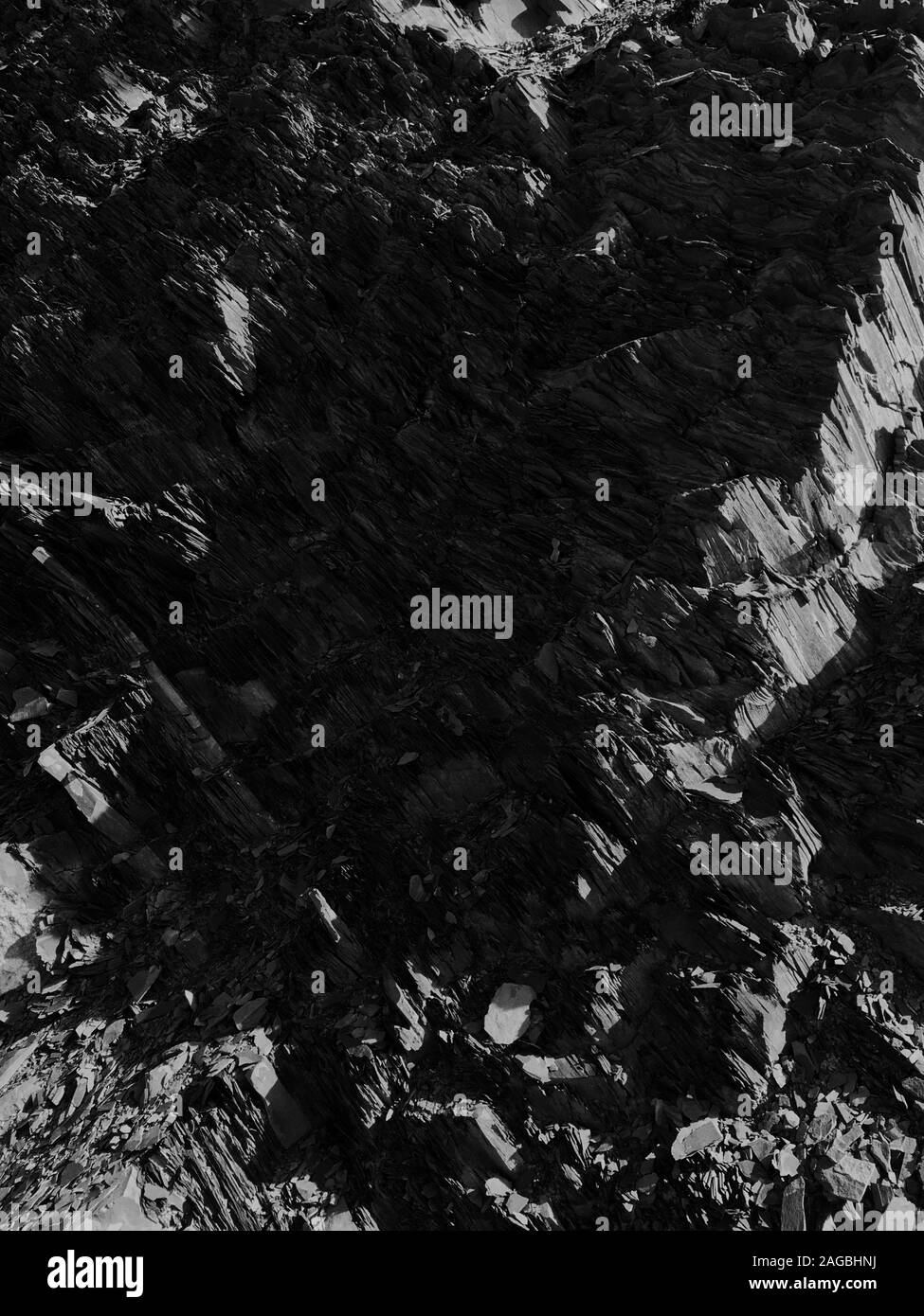 Vertical grey scale shot beautiful layers of old rocks Stock Photo - Alamy