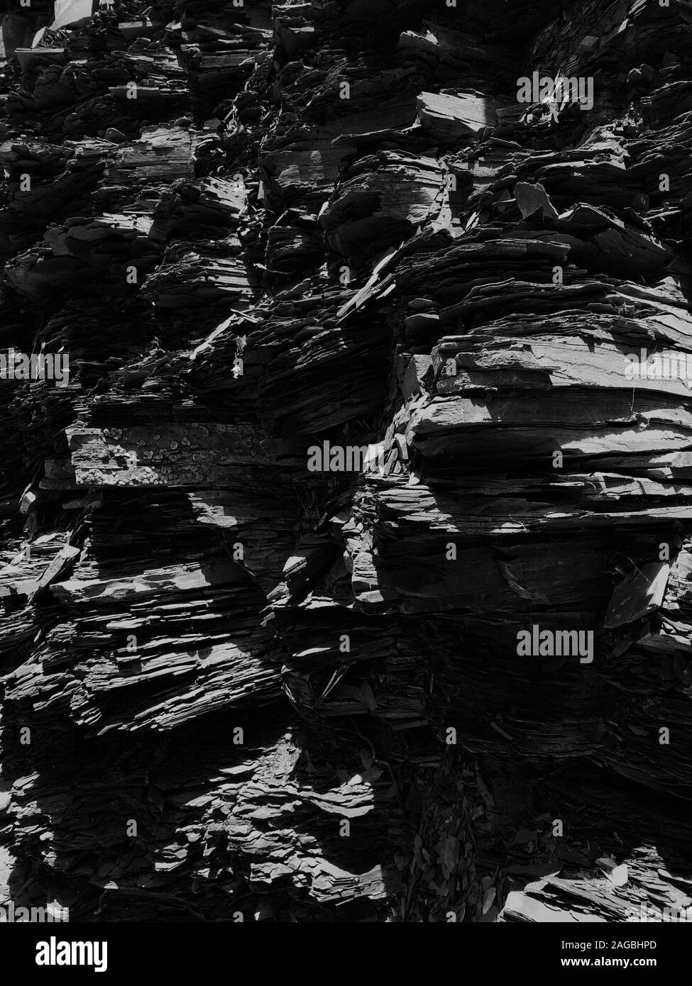 Vertical grey scale shot of beautiful layers of old rocks Stock Photo ...