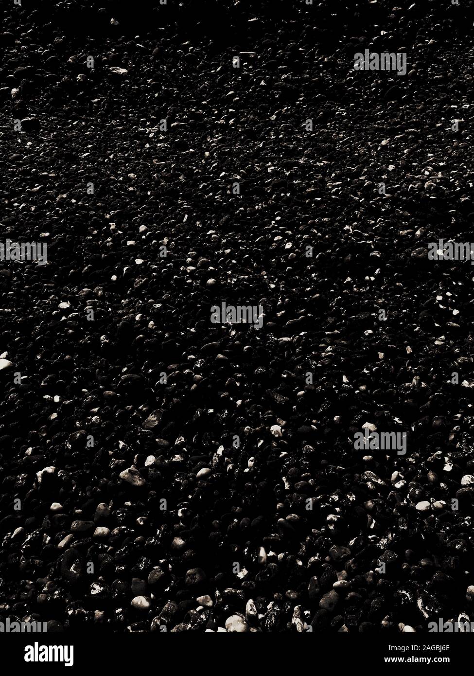 Vertical grey scale shot of the small rocks and pebbles Stock Photo - Alamy