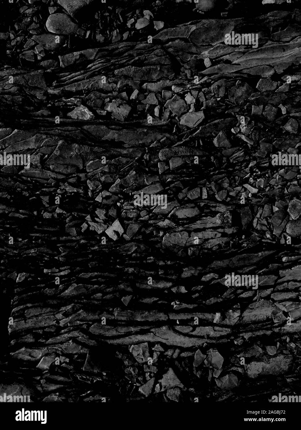 Vertical grey scale shot of small rocks and pebbles Stock Photo - Alamy