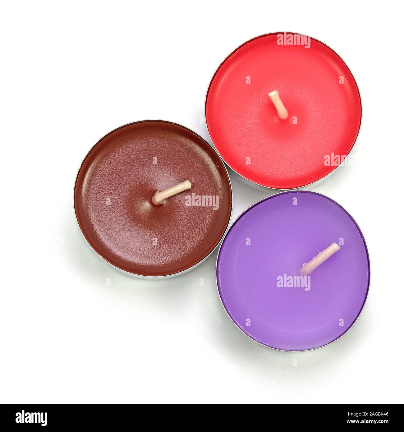 Colorful tea lights against white background Stock Photo - Alamy