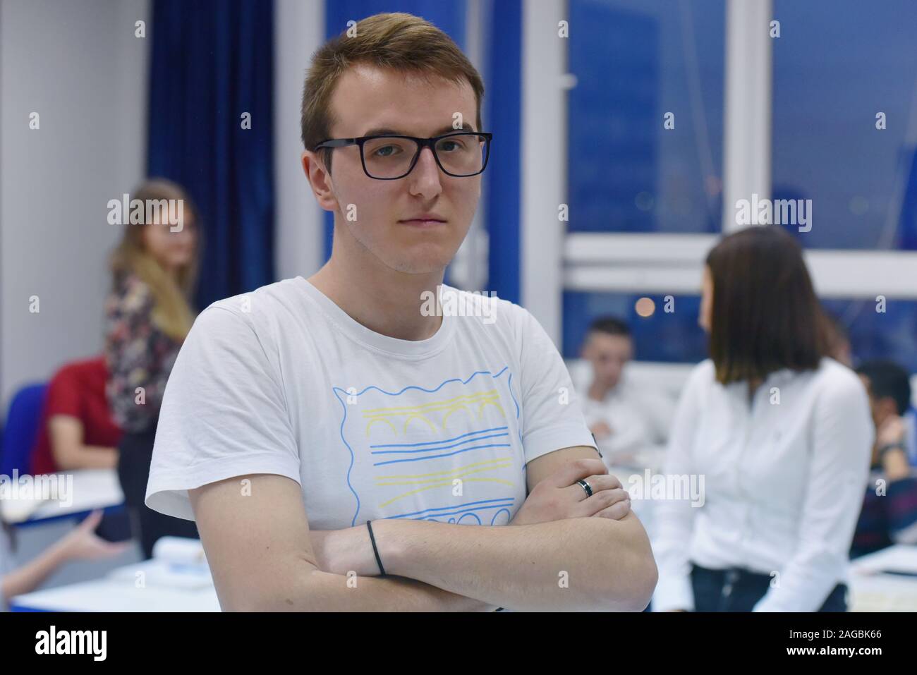 Group of students study in modern school classroom. Male student ...