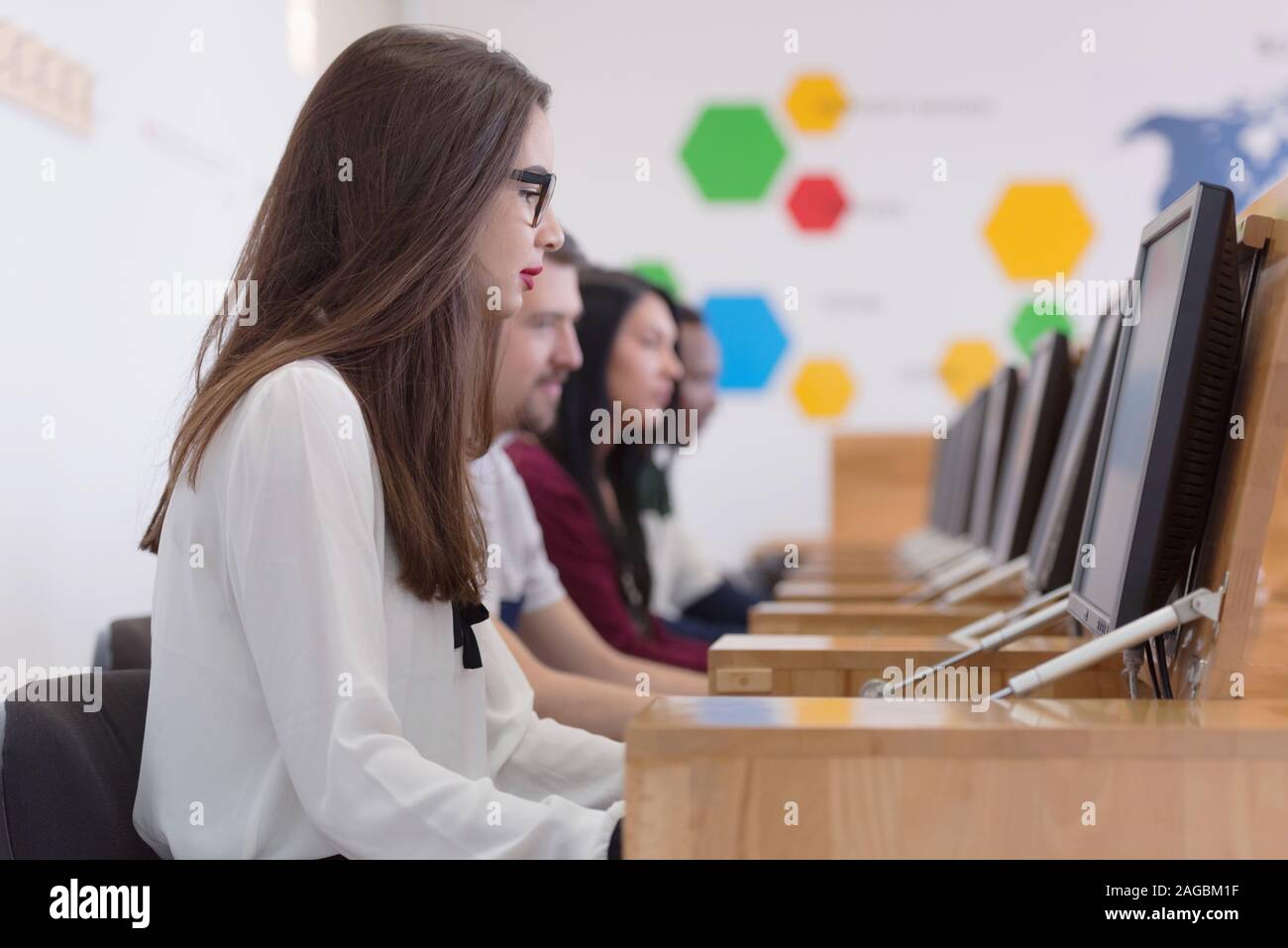 Group of students study in modern school computer lab classroom ...