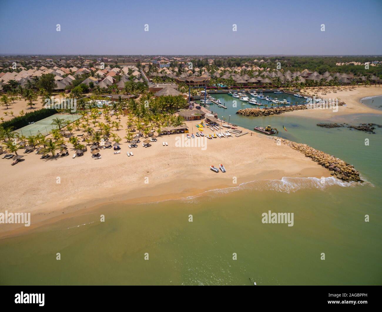 High shot of a sea with cruise ships surrounded by beaches and palms in ...