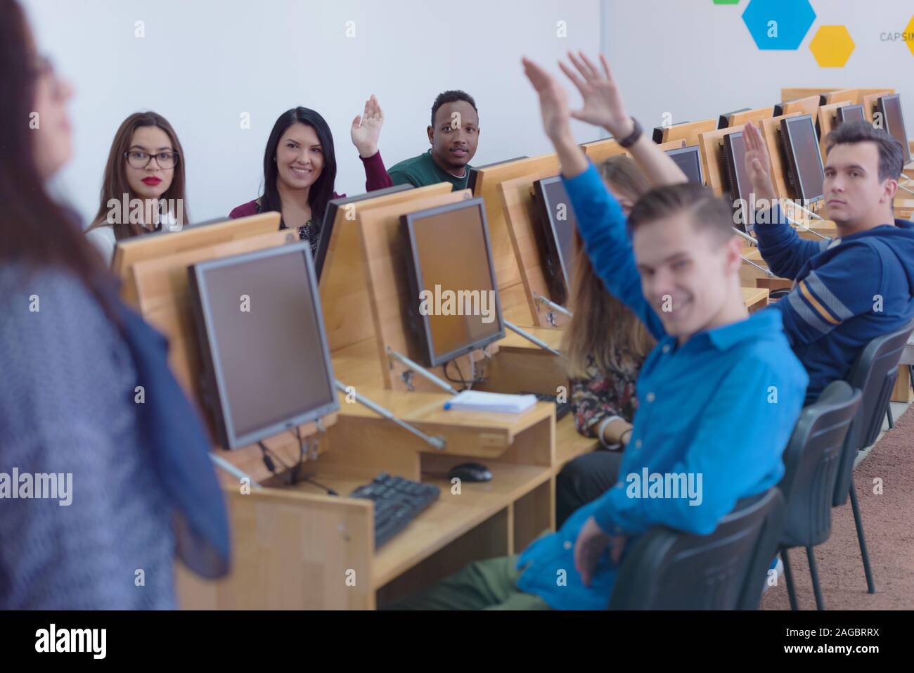 Female professor explain to students and interact with them in the ...