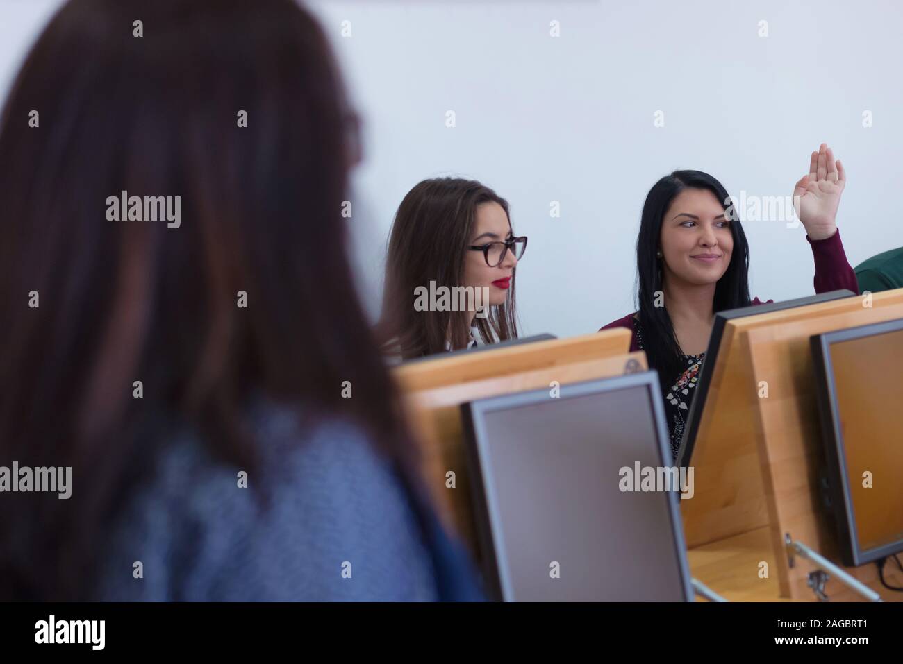 Female professor explain to students and interact with them in the ...