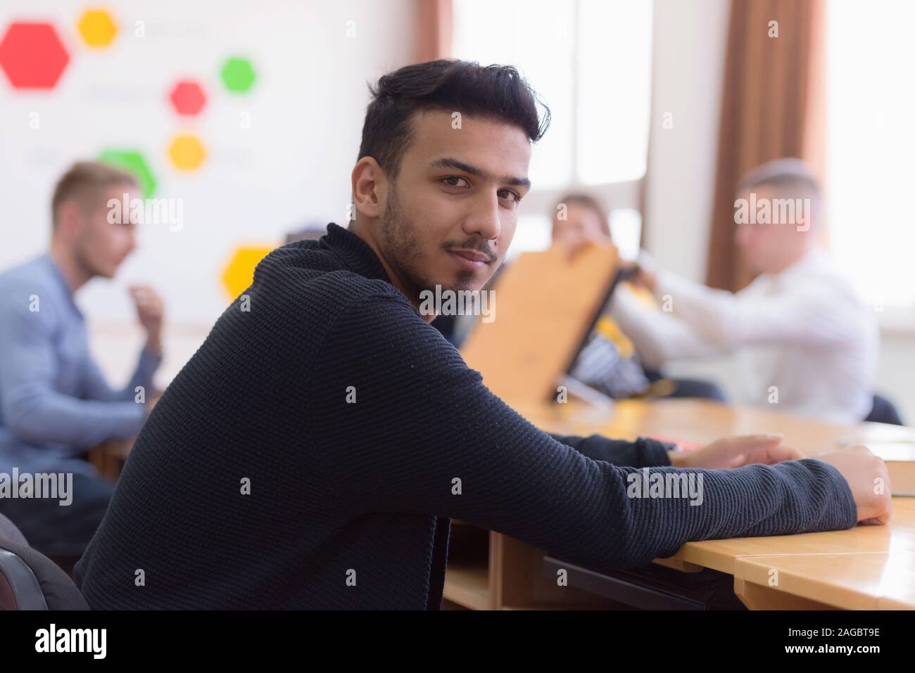 Male african american university student work at computer lab at ...