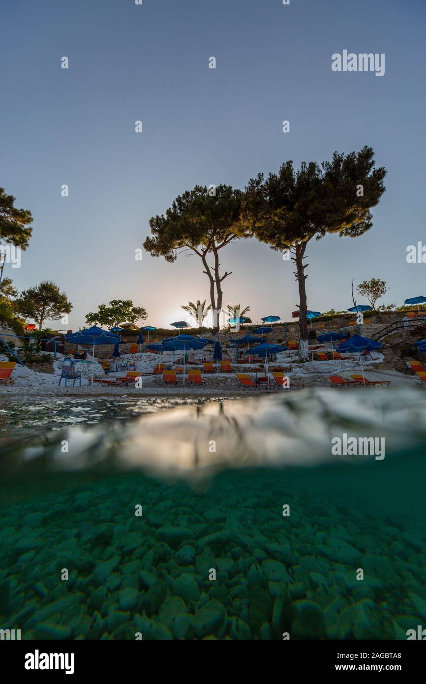 Vertical shot of the beautiful beach by the calm ocean captured in ...