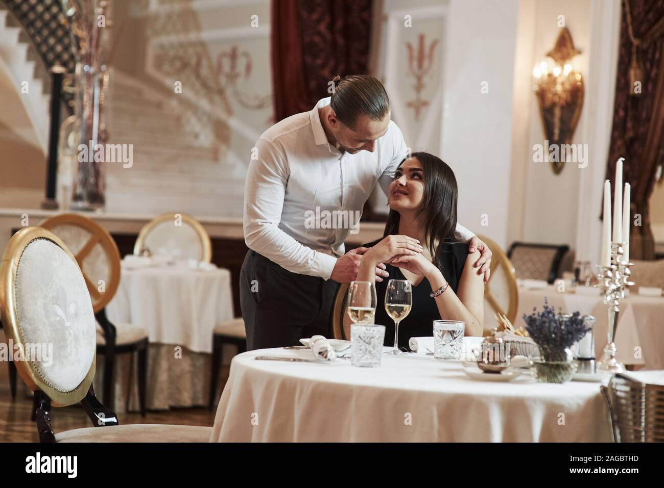 Beautiful couple have romantic dinner in luxury restaurant at evening ...