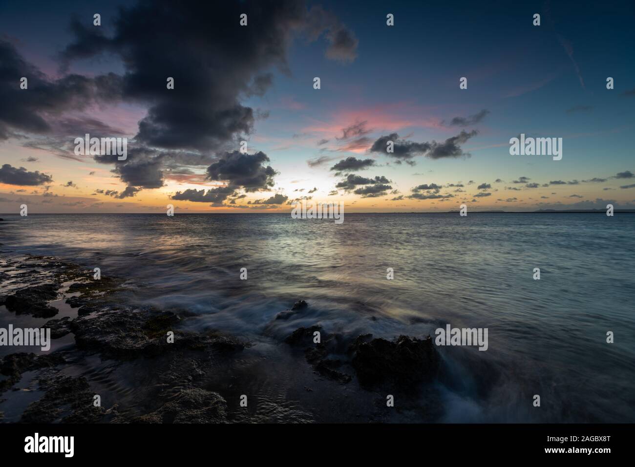 Breathtaking sunset reflecting in the ocean in Bonaire, Caribbean Stock ...