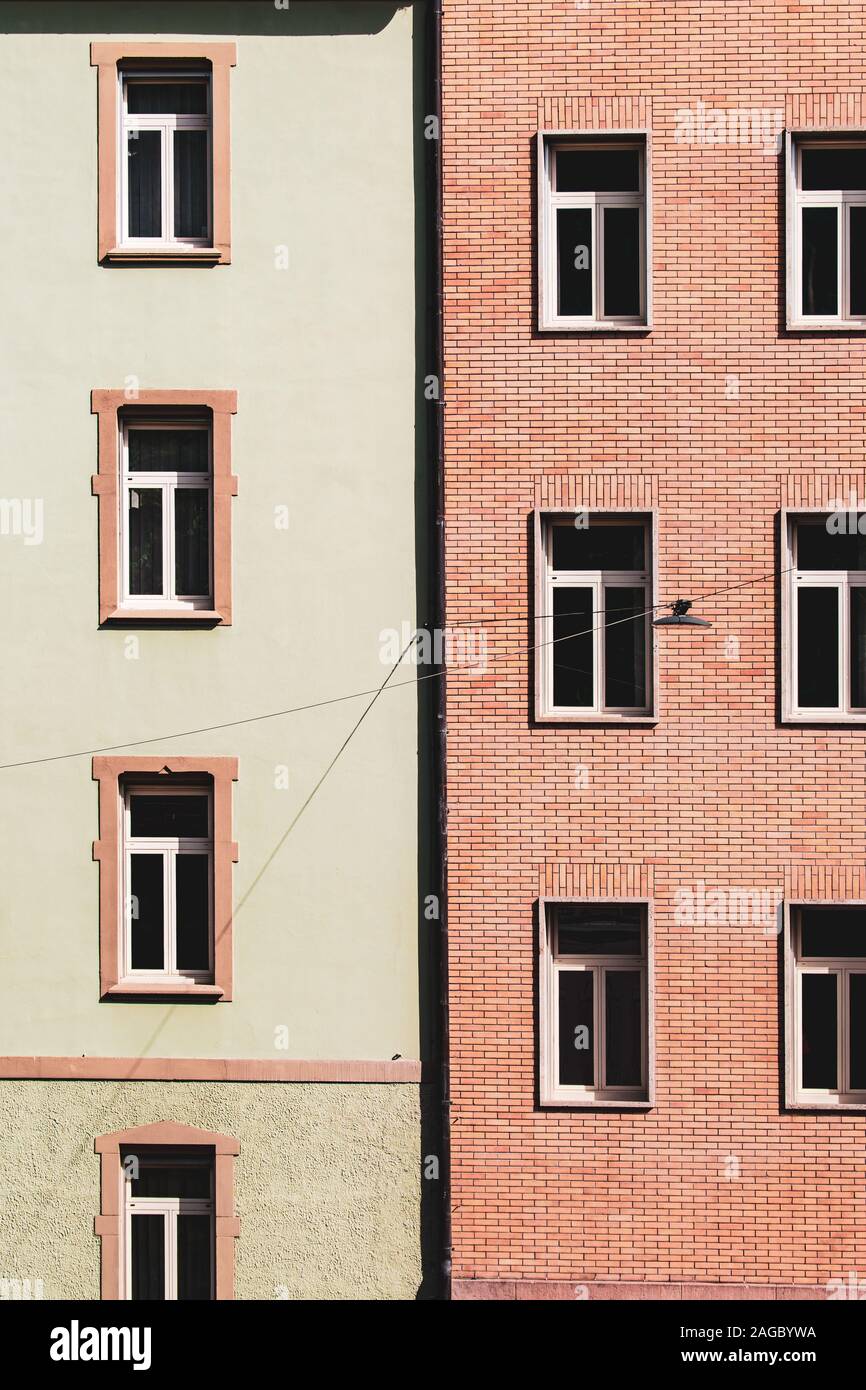 Vertical shot of a brick building and a white cement building Stock ...